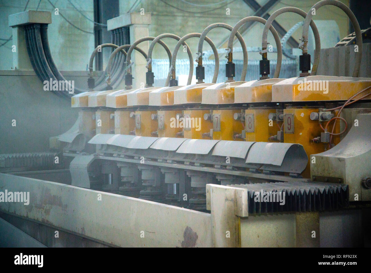 Dirty industrial room with big machine tools. Big old machine in the ...