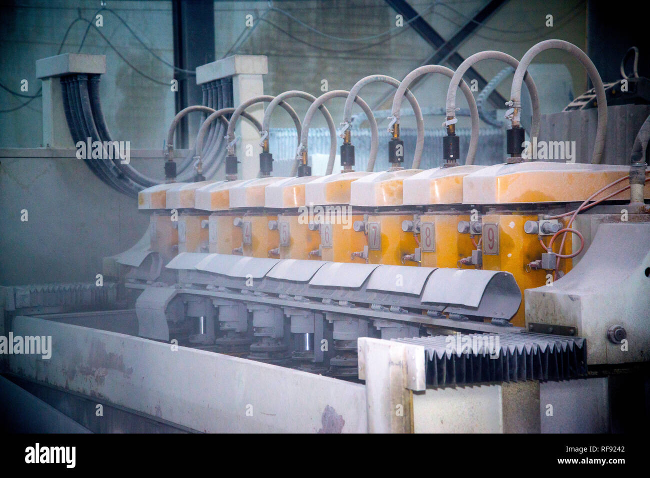 Dirty industrial room with big machine tools. Big old machine in the ...