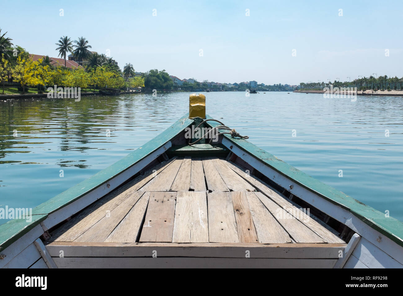 Bow of a wooden tourist passenger ferry on the Thu Bon River in Hoi An ...