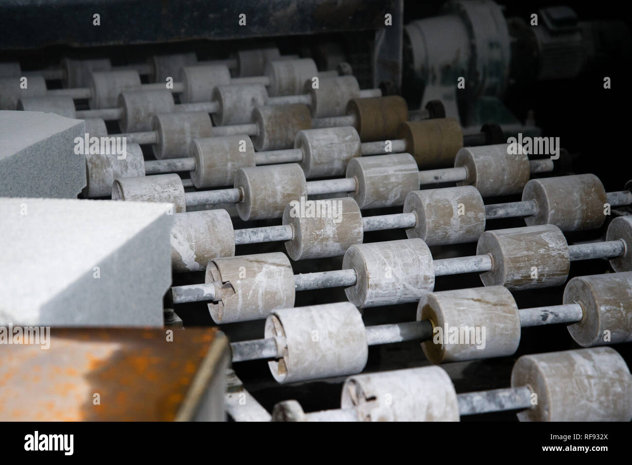 Conveyor on the grinding machine. Rollers Stock Photo - Alamy