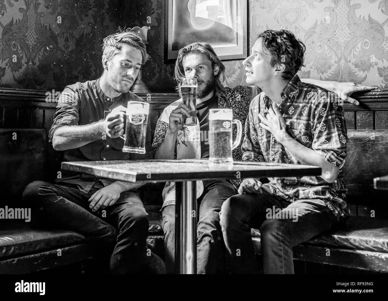 Men drinking beer in a pub Black and White Stock Photos & Images - Alamy