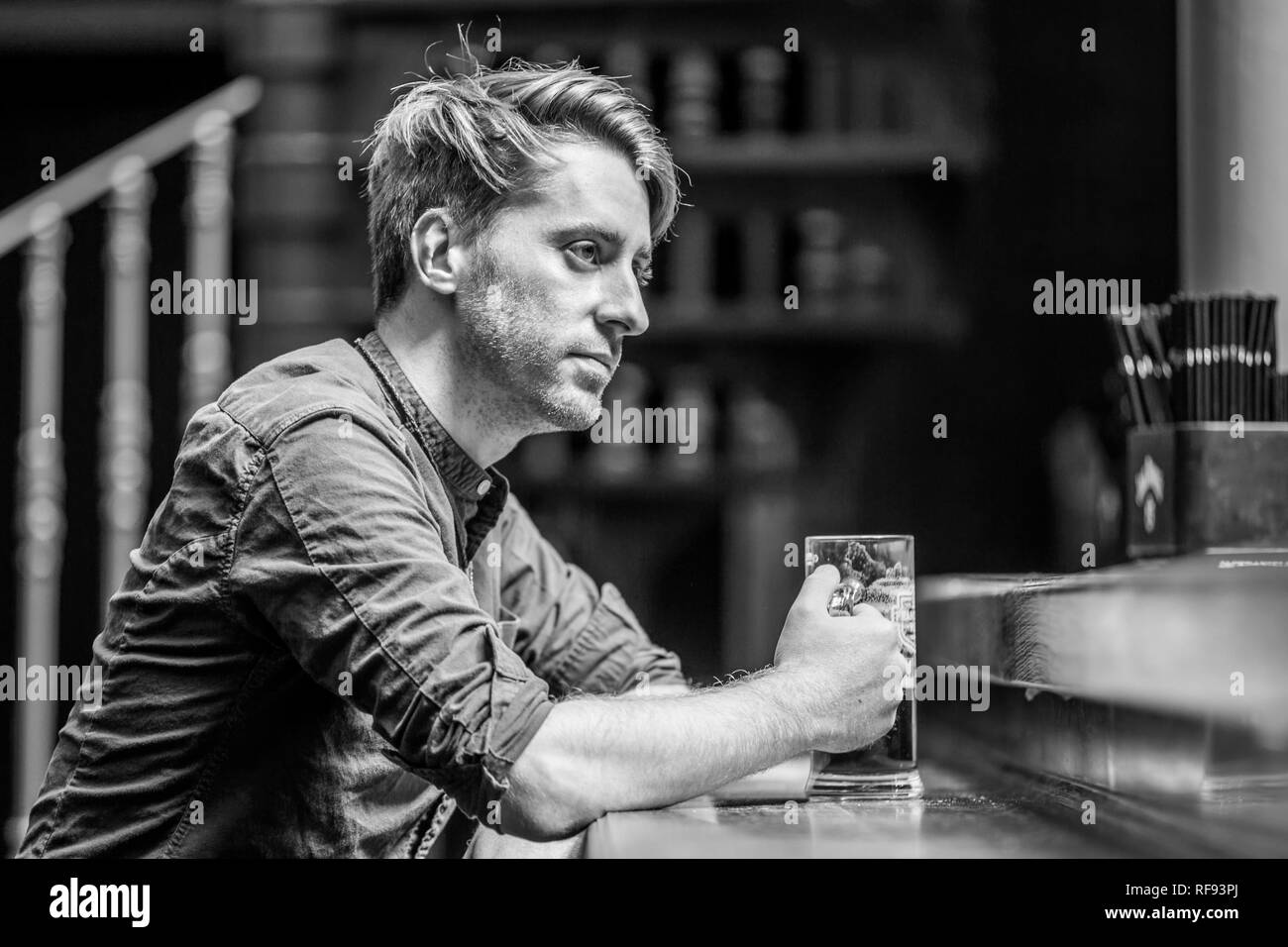 Men drinking bar stool Black and White Stock Photos & Images - Alamy