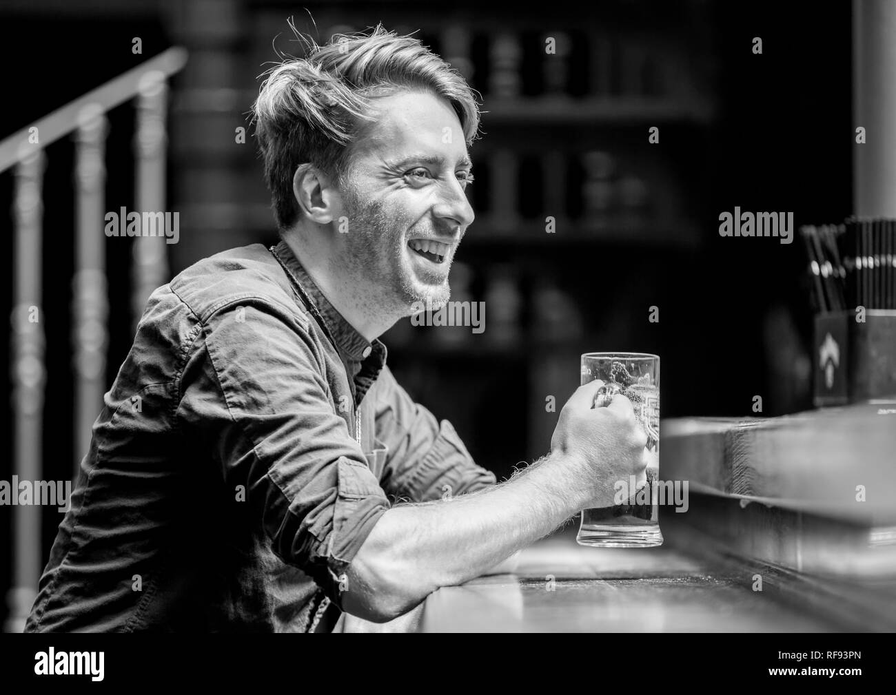 Man drinking a pint of lager Black and White Stock Photos & Images - Alamy
