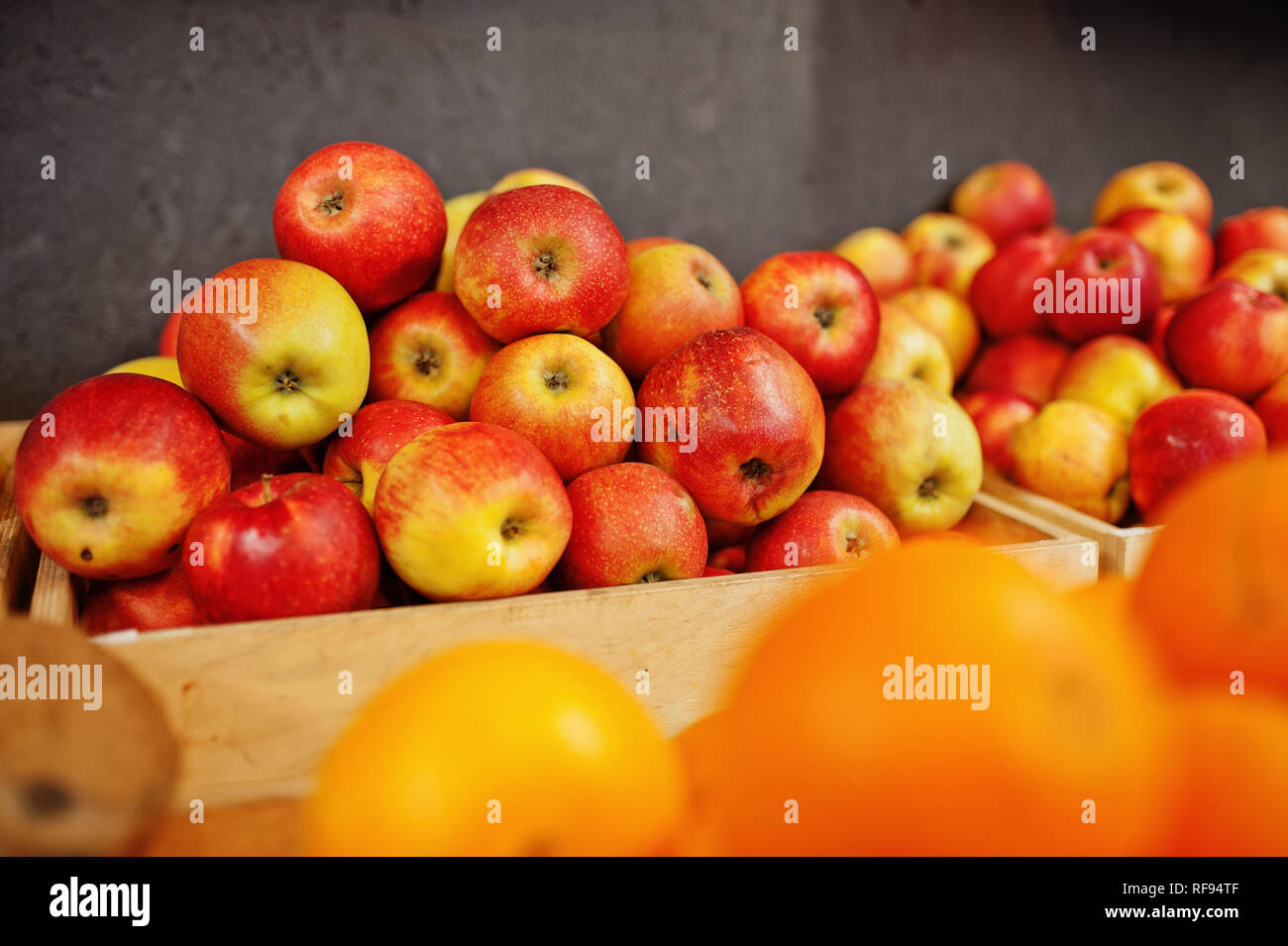 Colorful shiny fresh fruits. Red apples on the shelf of a supermarket ...