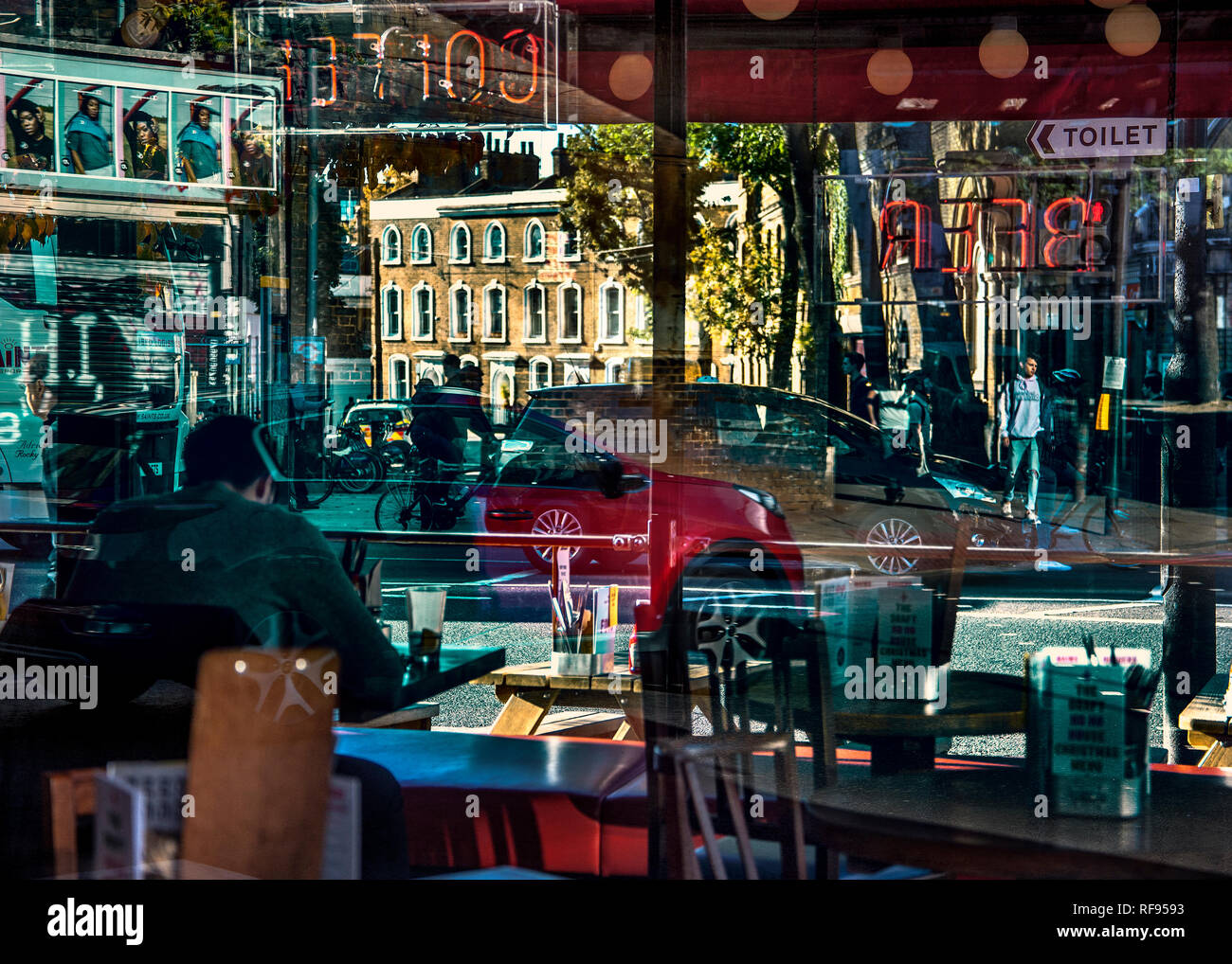 colourfull/colorfull street life reflected in buildings windows Stock ...