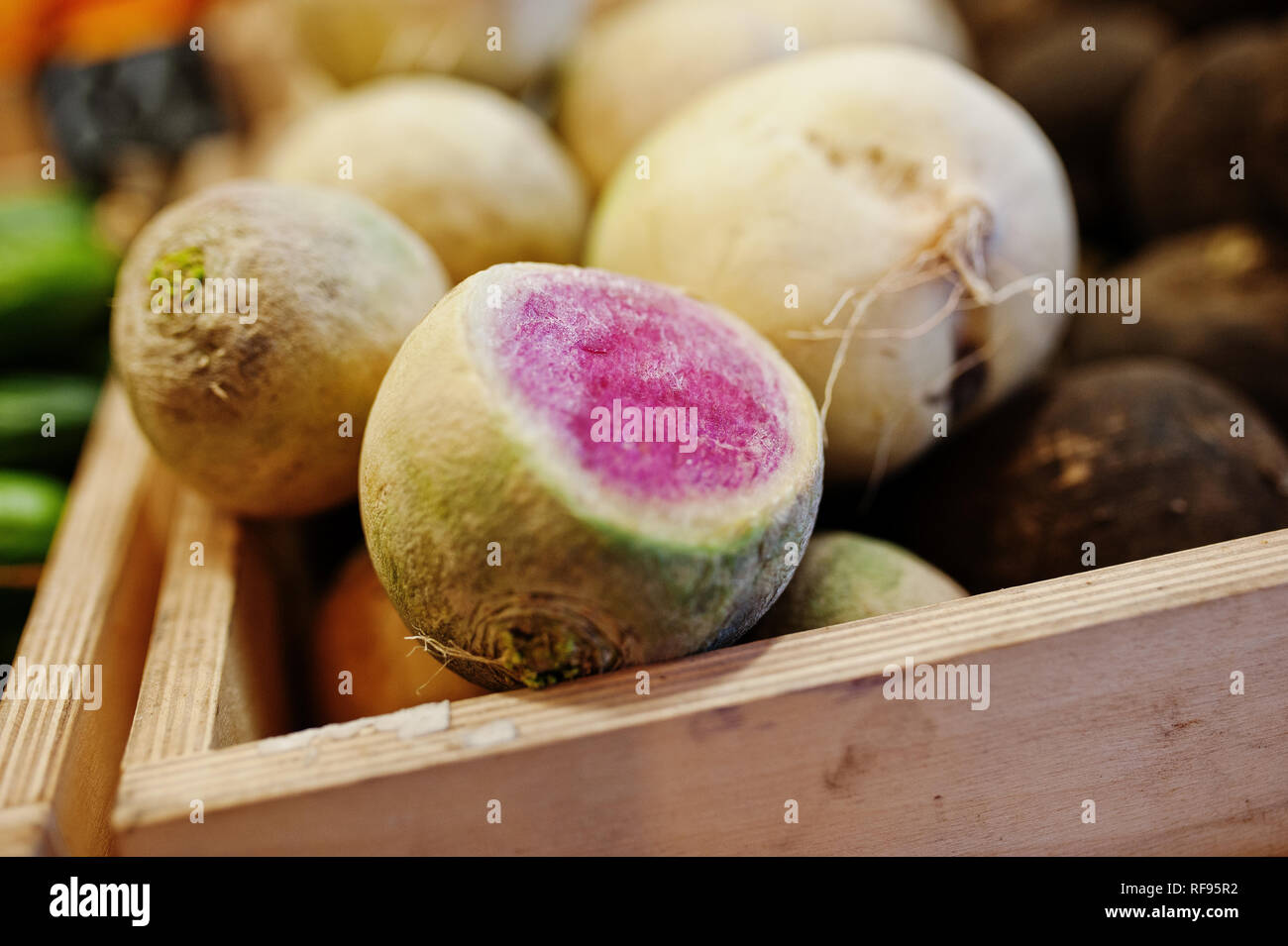 Colorful shiny fresh vegetables. Turnips on the shelf of a supermarket ...