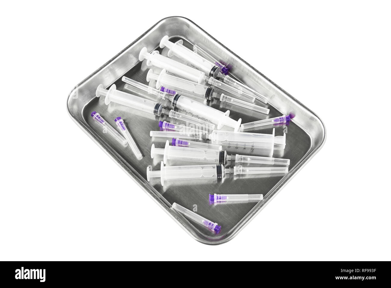 Metal salver with syringes and needles. Isolated on white background ...
