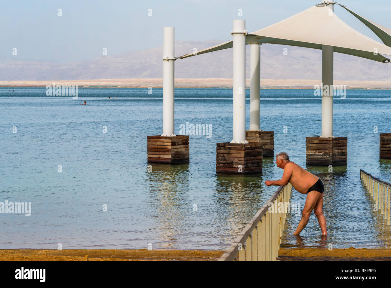 Man relaxing at the Dead Sea beach. Israel Stock Photo - Alamy