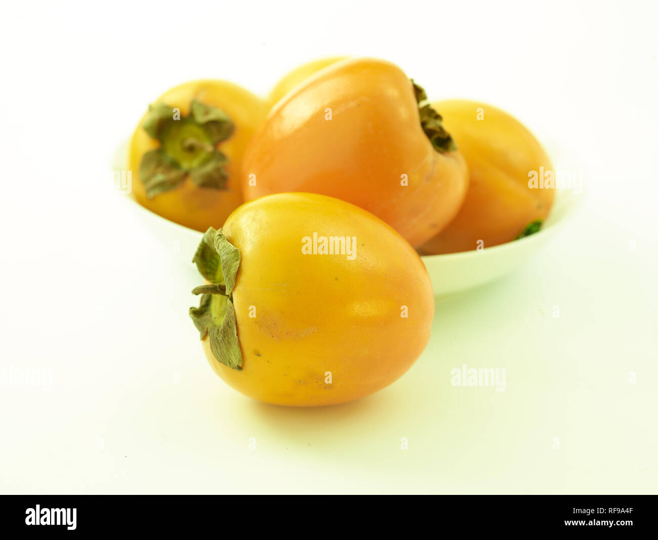 Sharon fruit still-life food photograph Stock Photo - Alamy