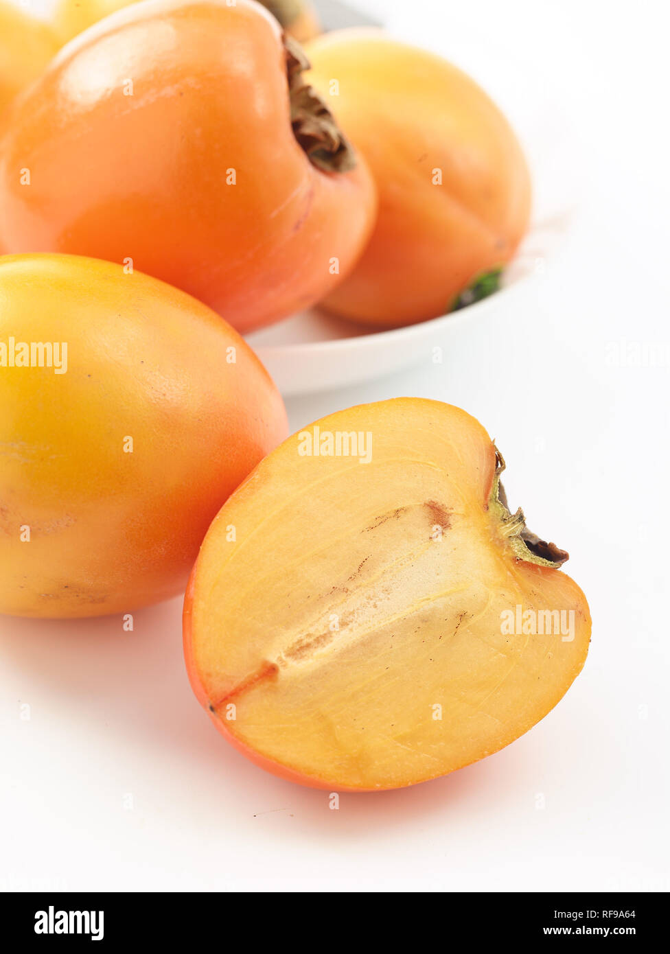 Sharon fruit still-life food photograph Stock Photo - Alamy