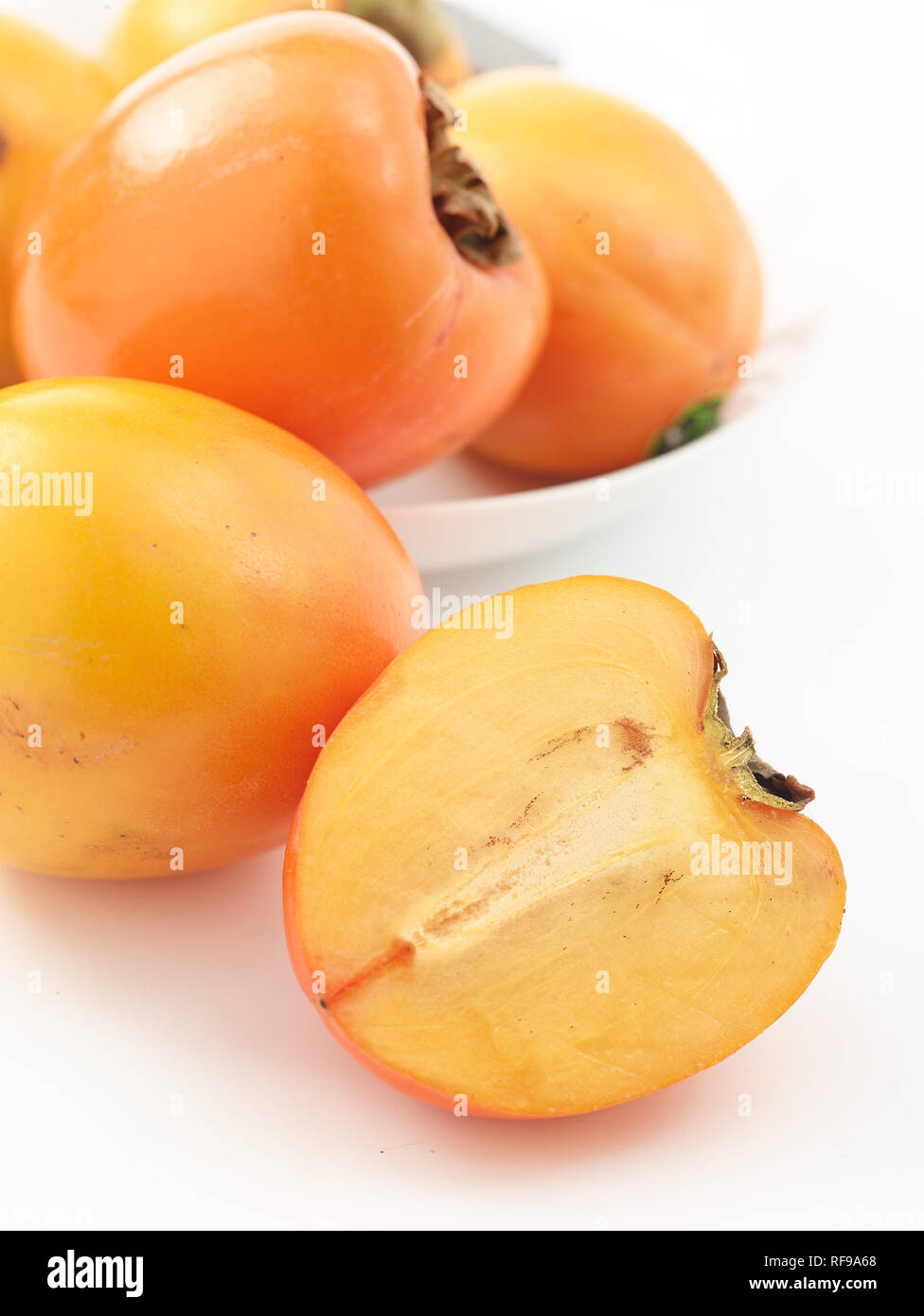 Sharon fruit still-life food photograph Stock Photo - Alamy