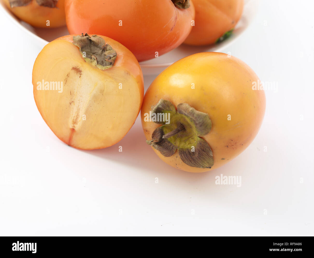 Sharon fruit still-life food photograph Stock Photo - Alamy