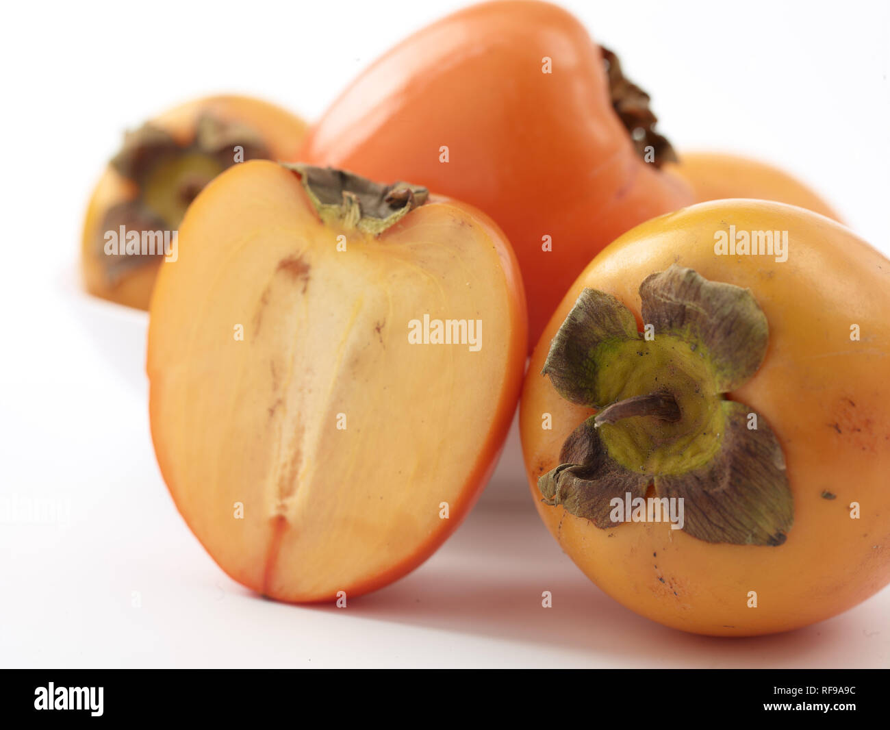 Persimmon, Sharon fruit, food still-life photograph Stock Photo - Alamy