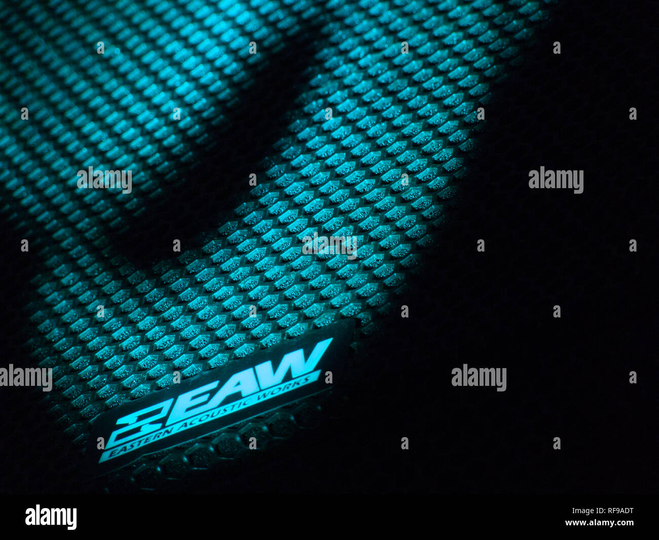 Blue textured stage light shines on an Eastern Acoustic Works speaker ...