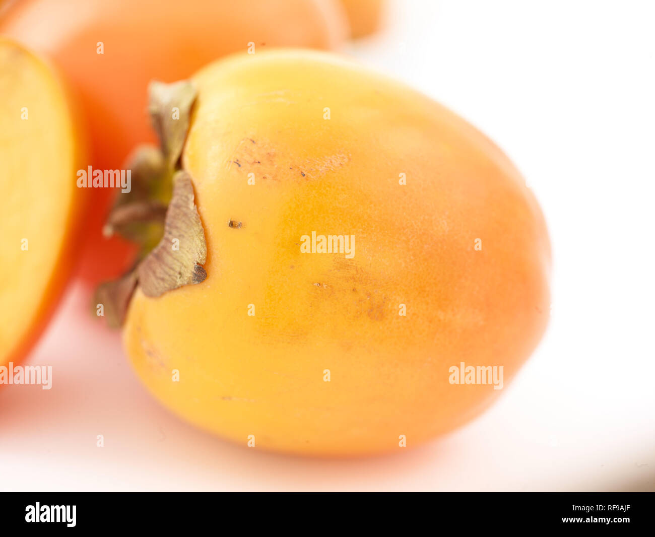 Persimmon, Sharon fruit, food still-life photograph Stock Photo - Alamy