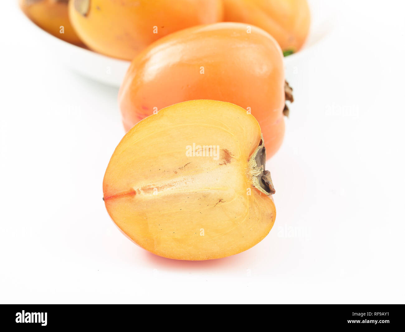 Persimmon, Sharon fruit, food still-life photograph Stock Photo - Alamy