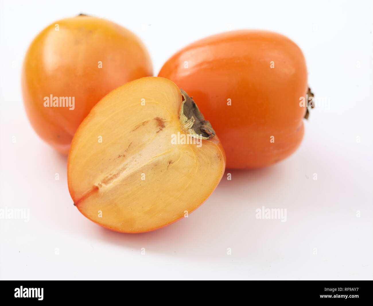 Persimmon, Sharon fruit, food still-life photograph Stock Photo - Alamy