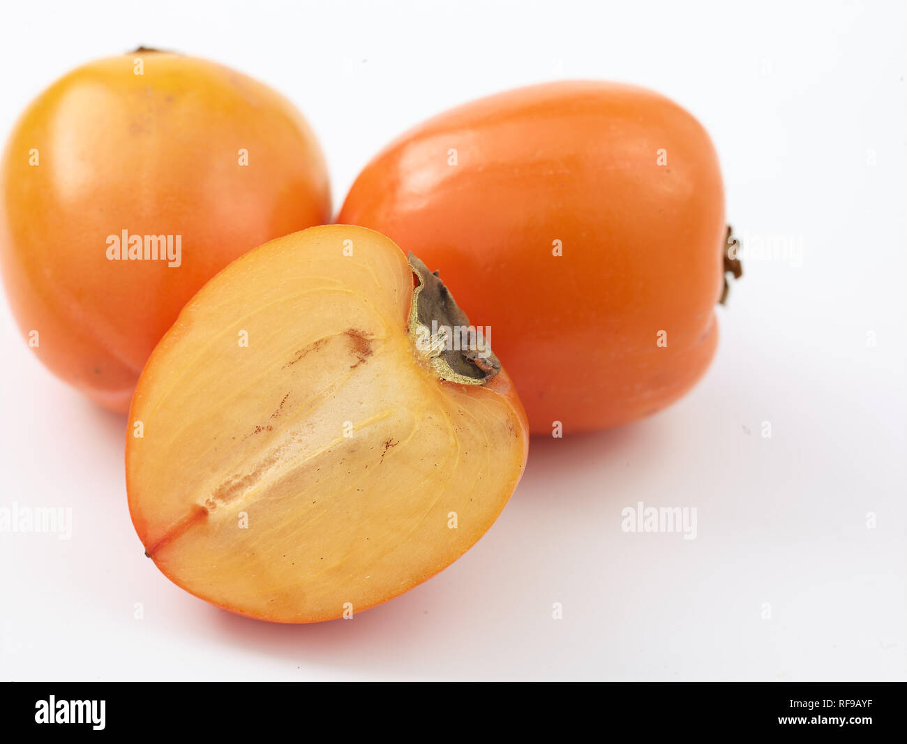 Persimmon, Sharon fruit, food still-life photograph Stock Photo - Alamy