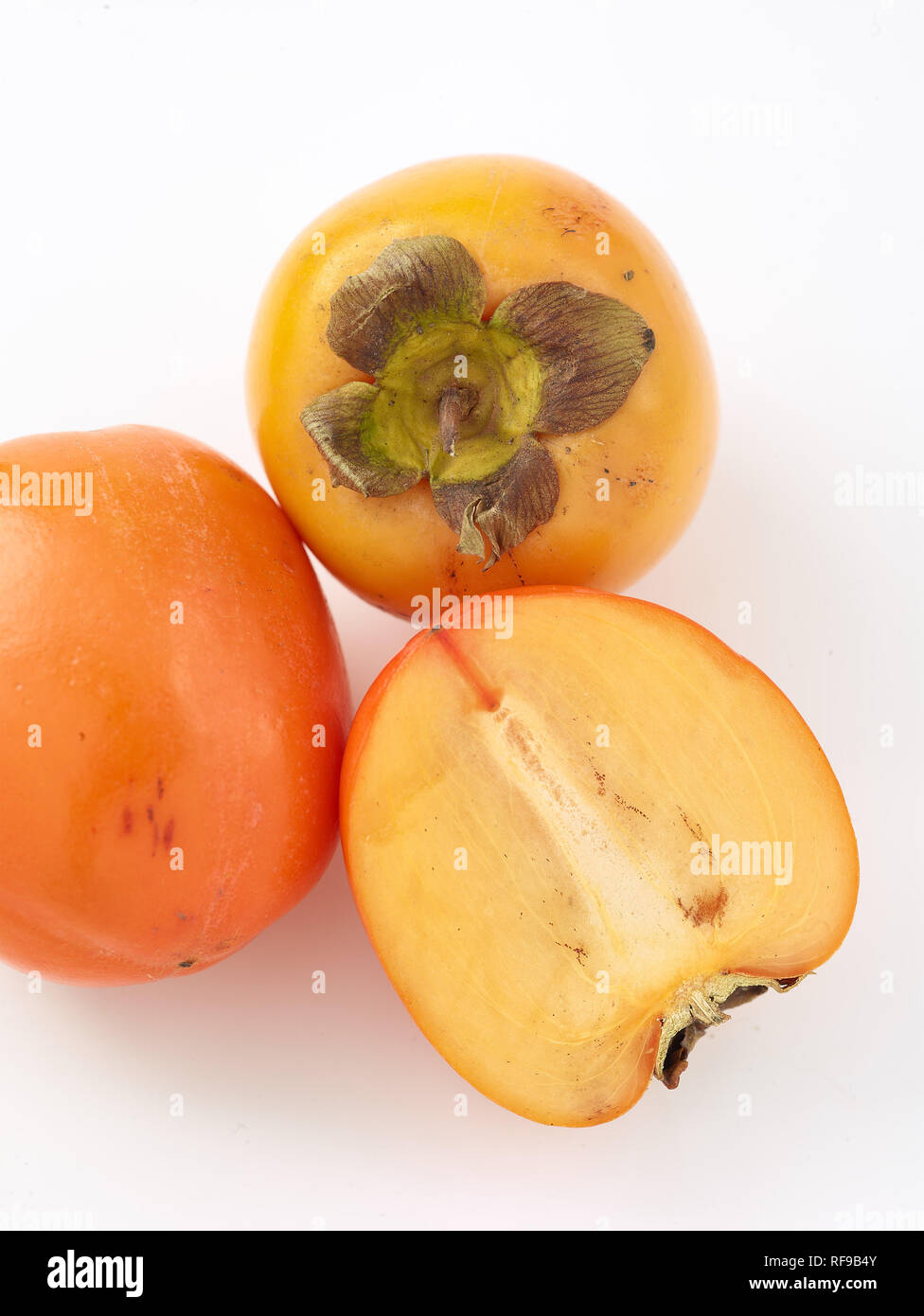 Persimmon, Sharon fruit, food still-life photograph Stock Photo - Alamy