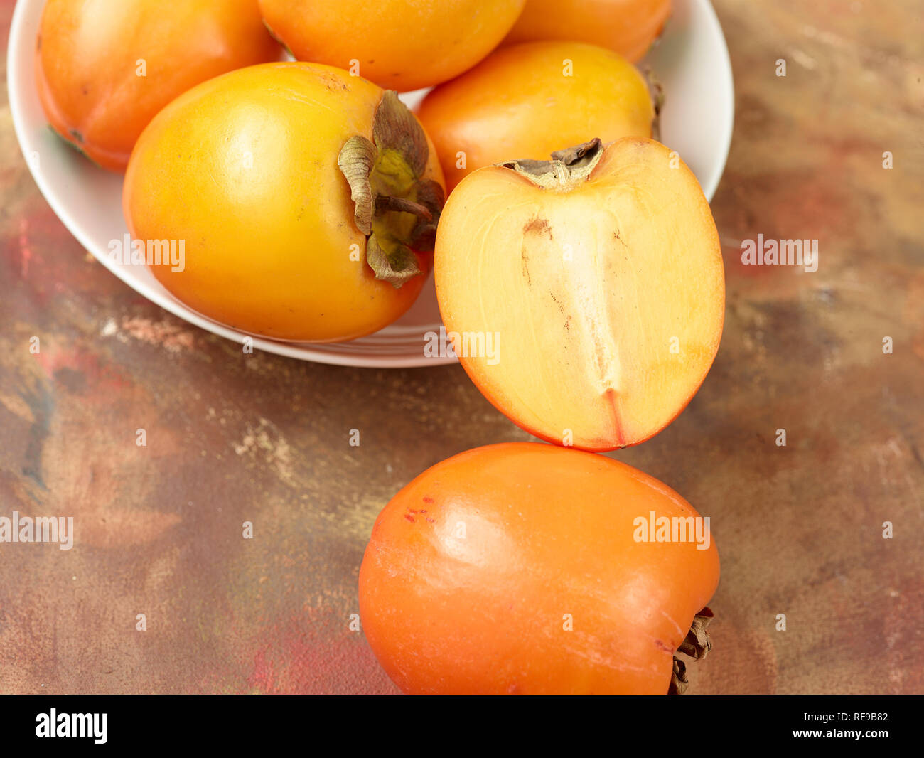 Persimmon, Sharon fruit, food still-life photograph Stock Photo - Alamy