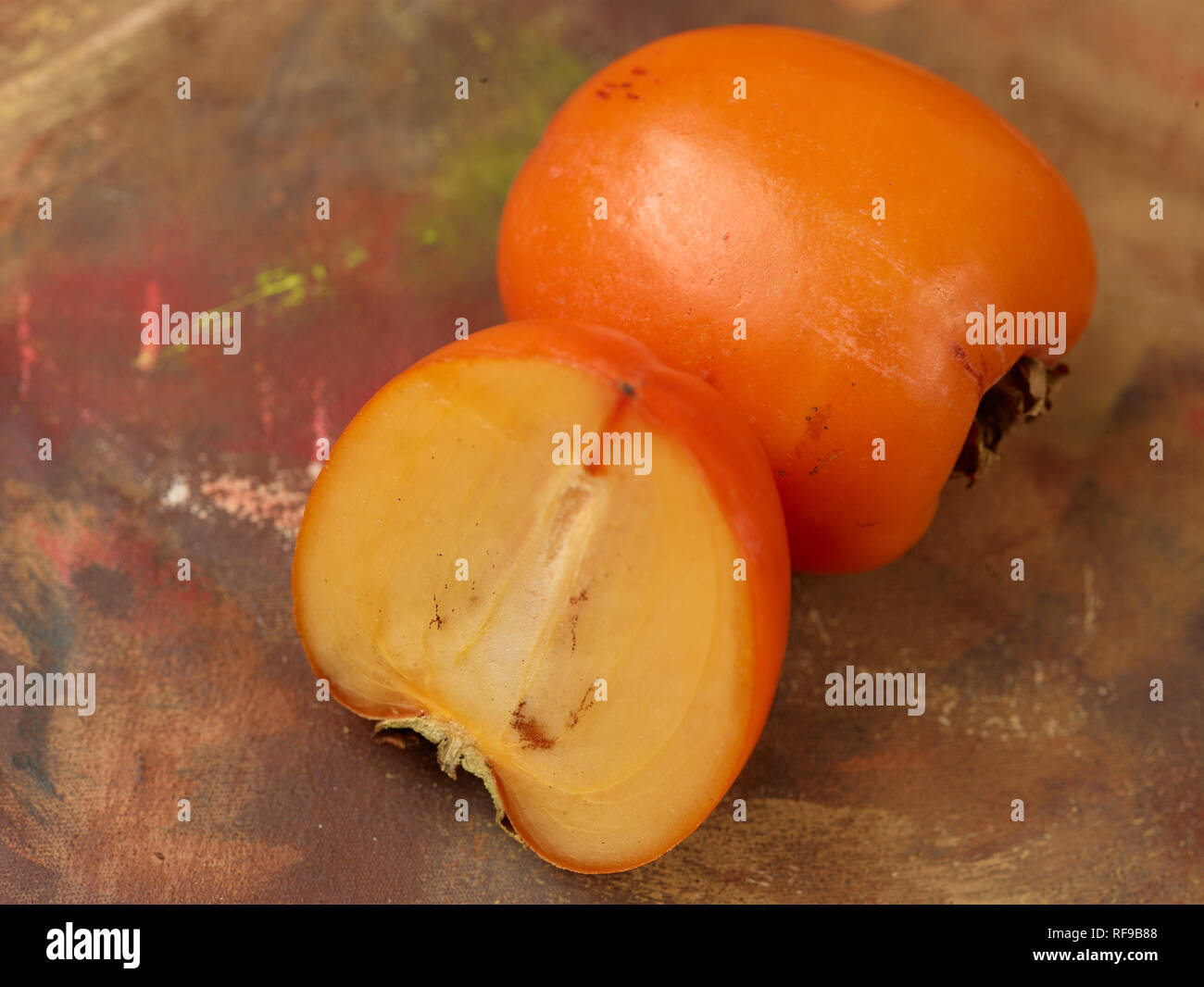 Persimmon, Sharon fruit, food still-life photograph Stock Photo - Alamy