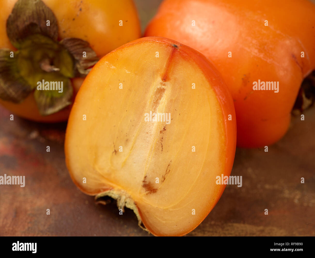 Sharon fruit still-life food photograph Stock Photo - Alamy