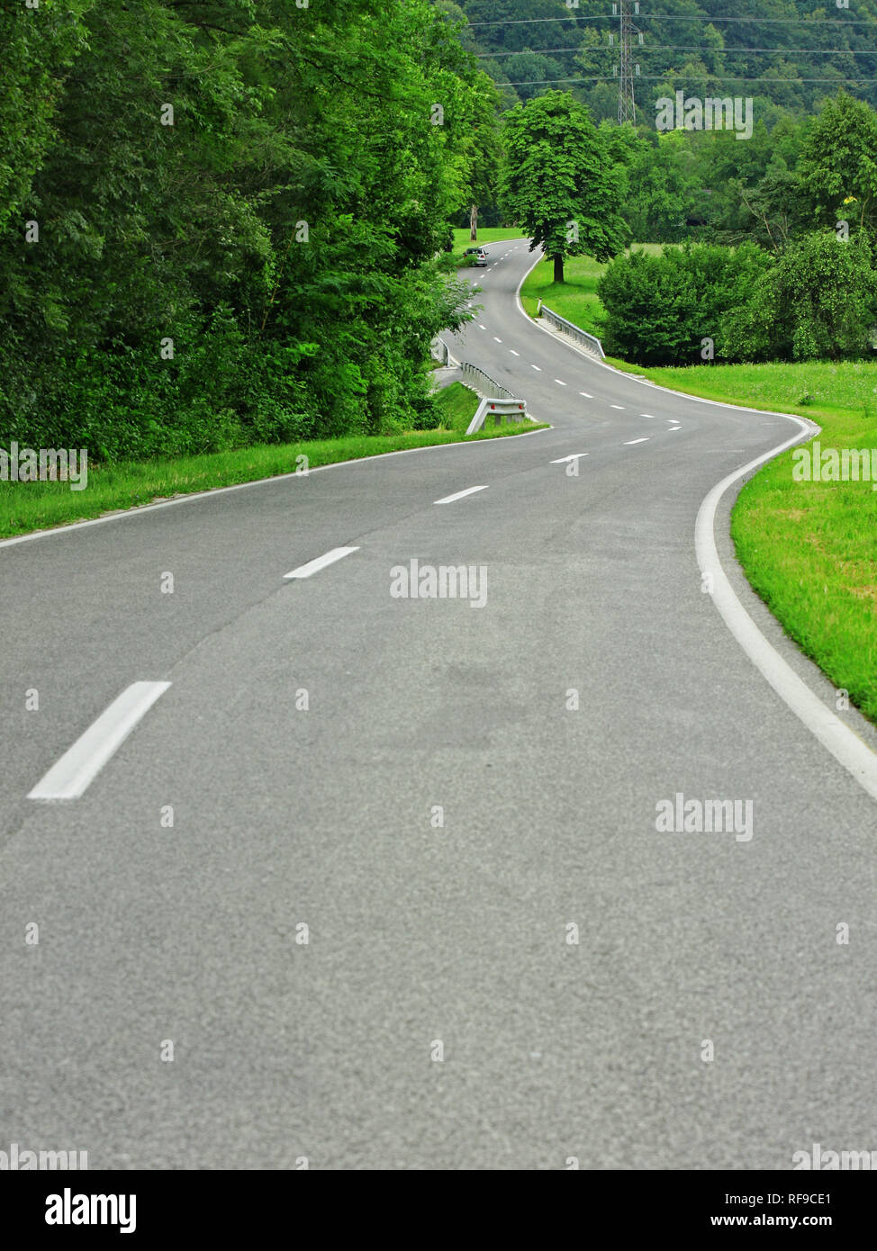 Asphalt winding curve road in nature Stock Photo - Alamy