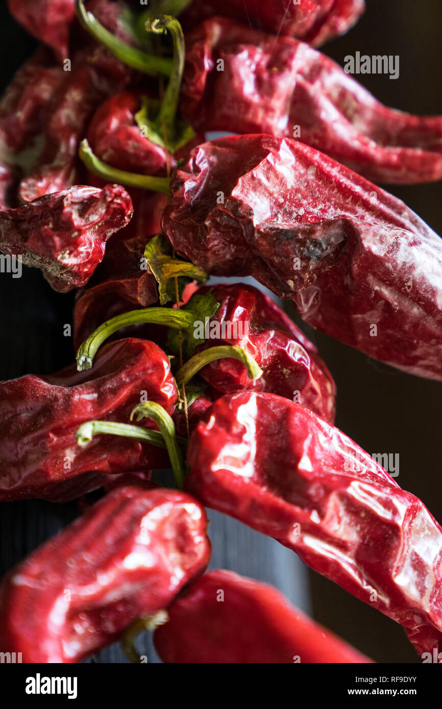 Dry red peppers on a string Stock Photo - Alamy