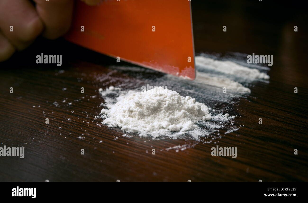 Cocaine powder on the table Stock Photo - Alamy