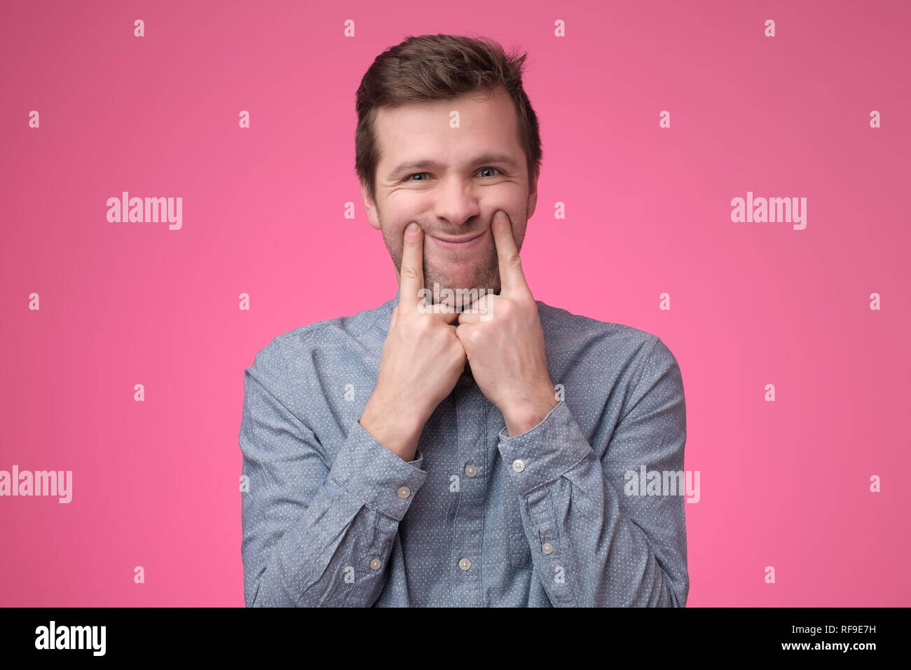 Mocking smile hi-res stock photography and images - Alamy