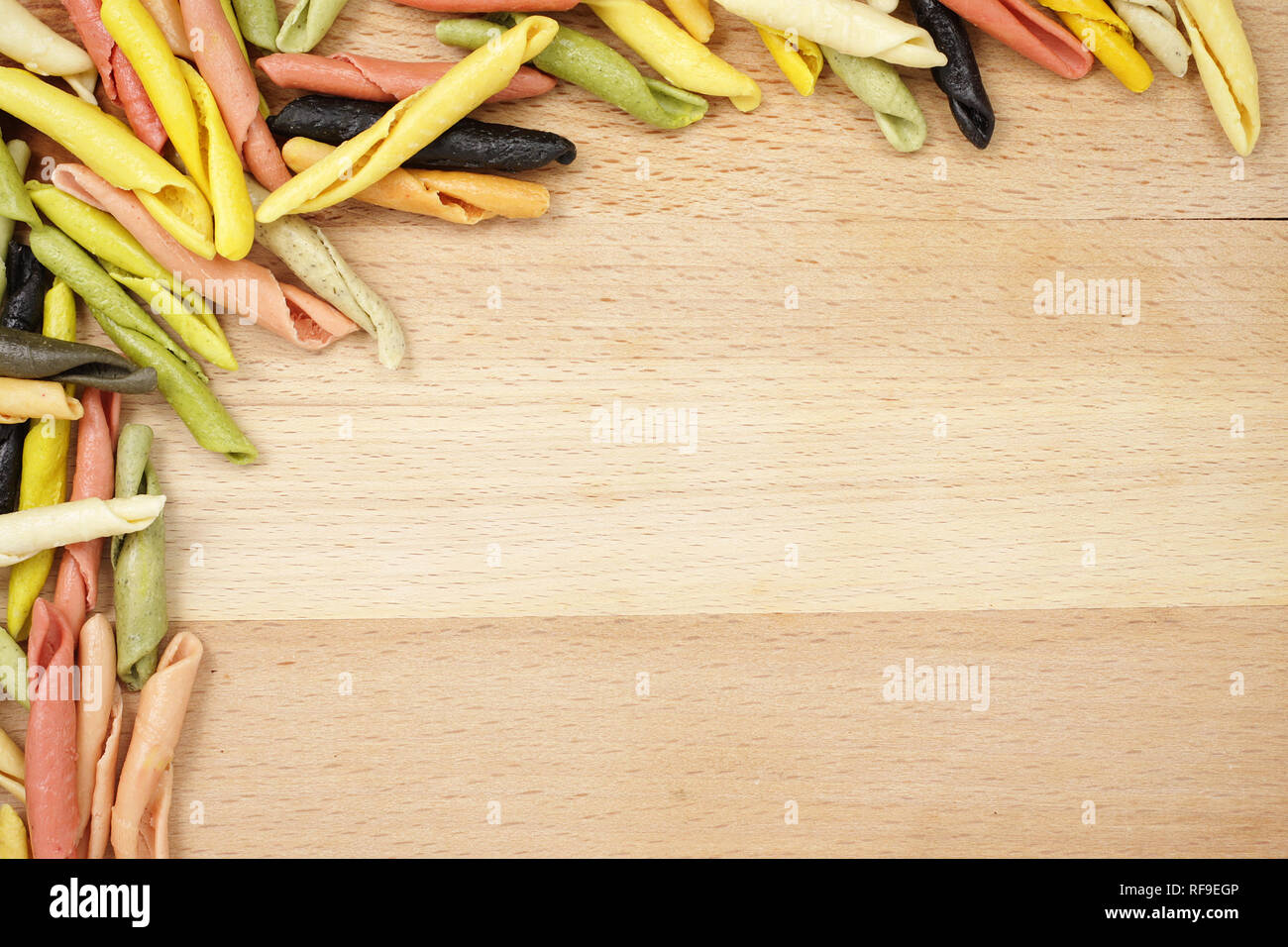 Colorful strozzapreti italian pasta border Stock Photo - Alamy