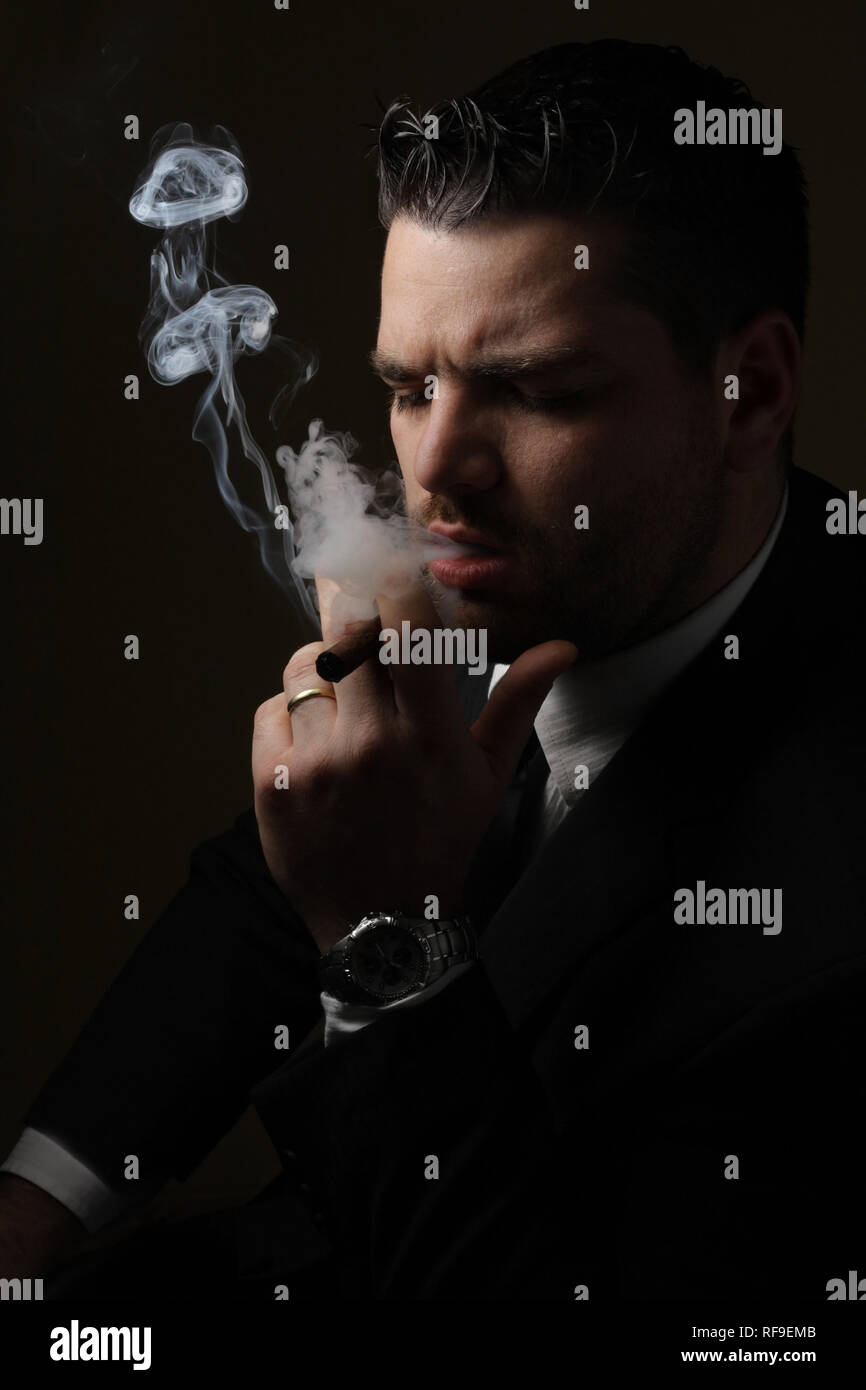 Low key portrait of adult smoker Stock Photo - Alamy