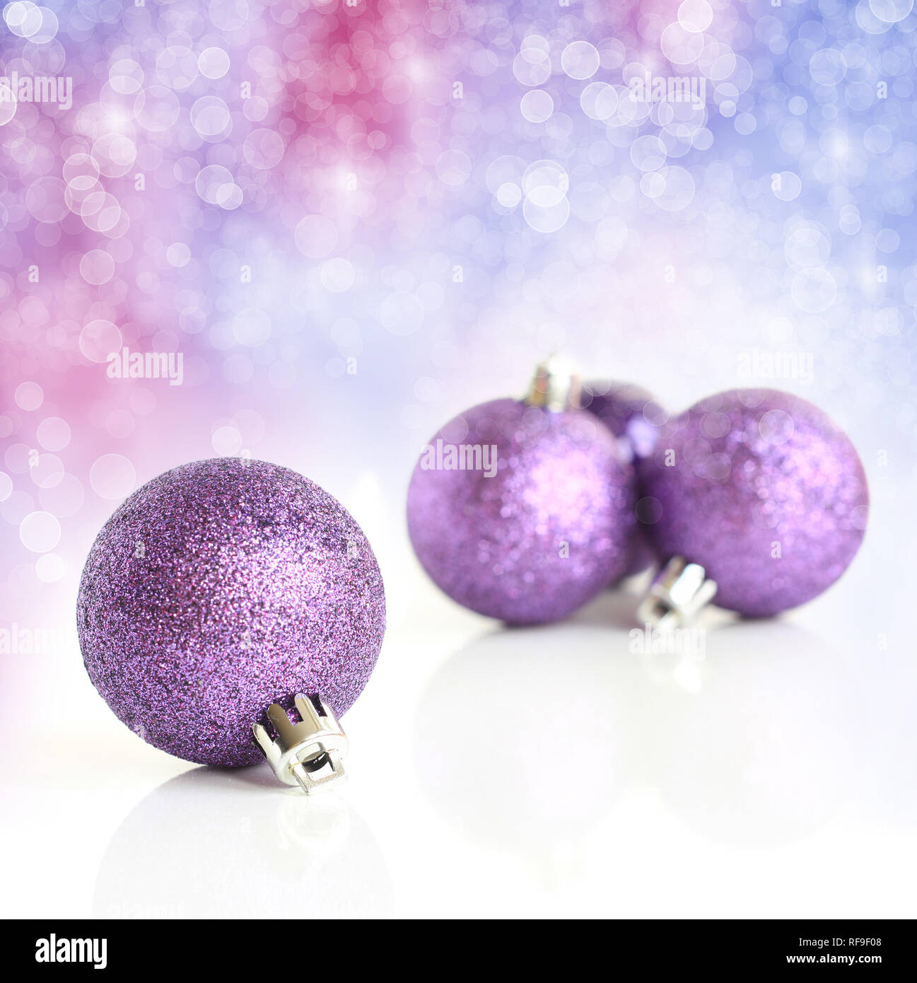 Purple baubles, isolated on white Stock Photo - Alamy