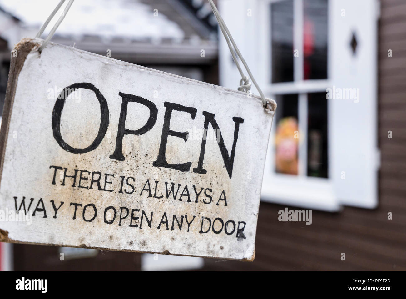 A weathered sign, “there is always a way to open any door“ Stock Photo ...