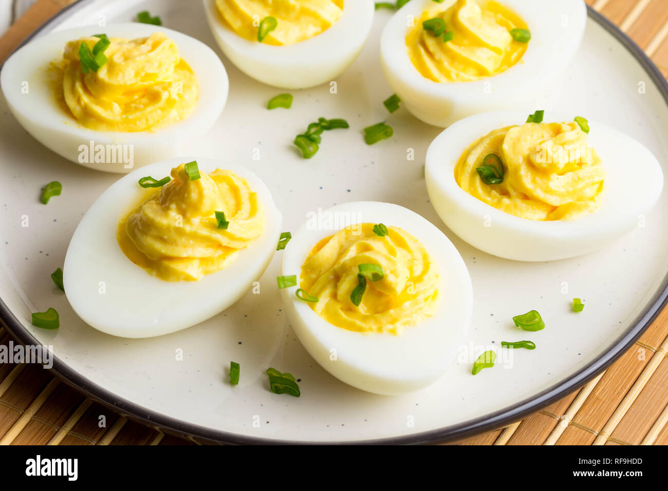 Stuffed eggs, yellow mousse, wine snack, holiday party Stock Photo - Alamy