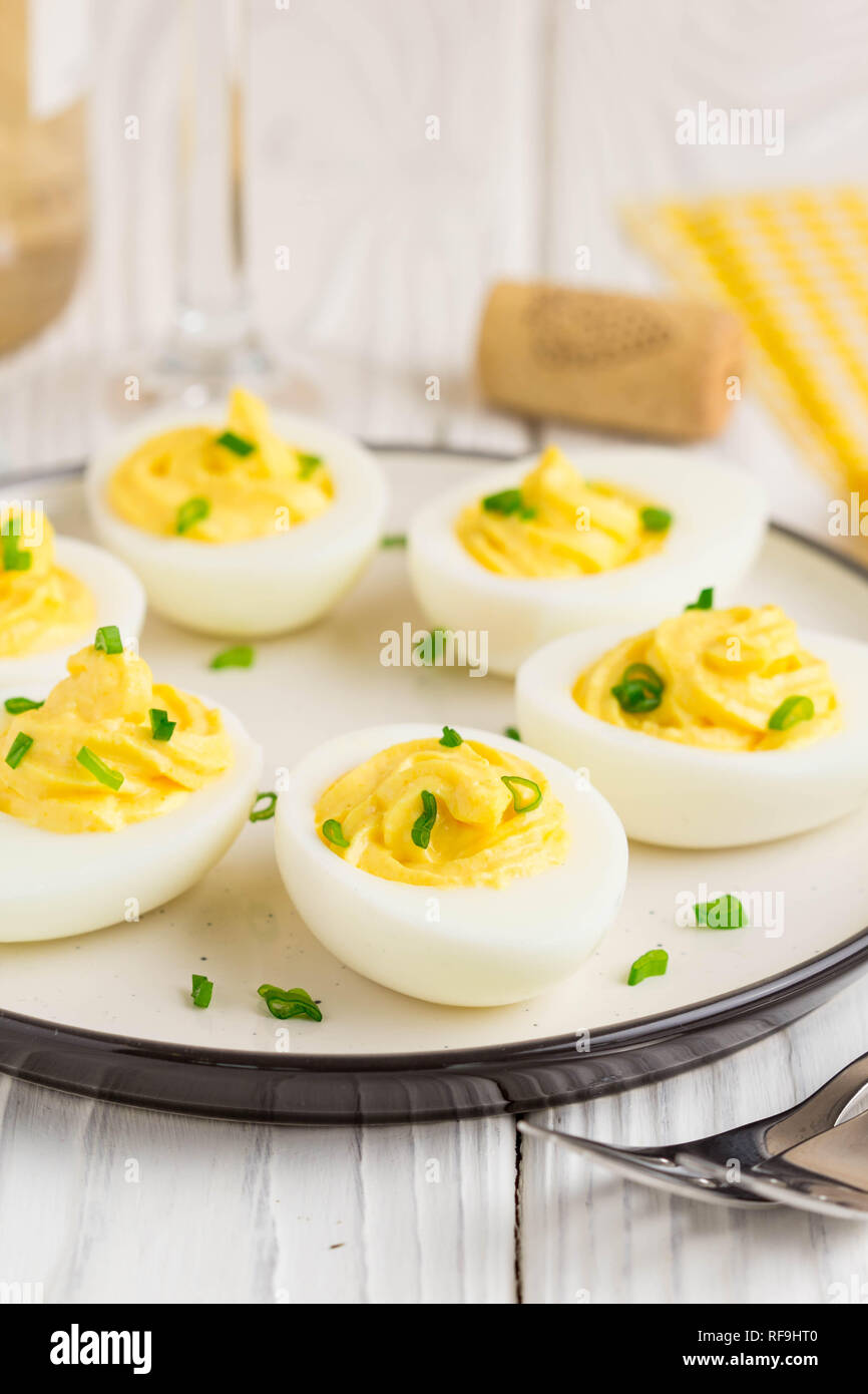 Stuffed eggs, yellow mousse, wine snack, holiday party Stock Photo - Alamy