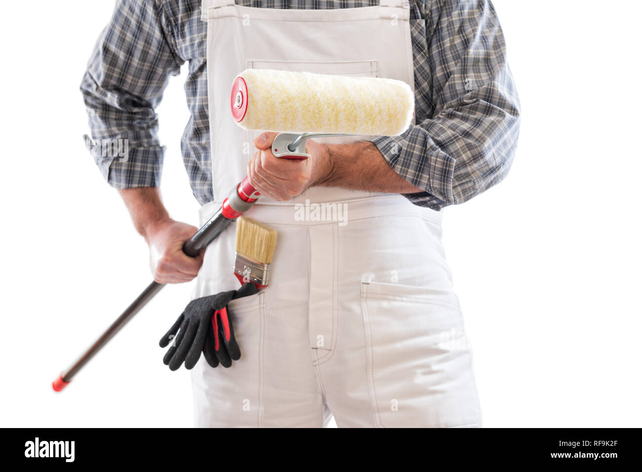 House painter worker with white work overalls, holds in his hand the ...