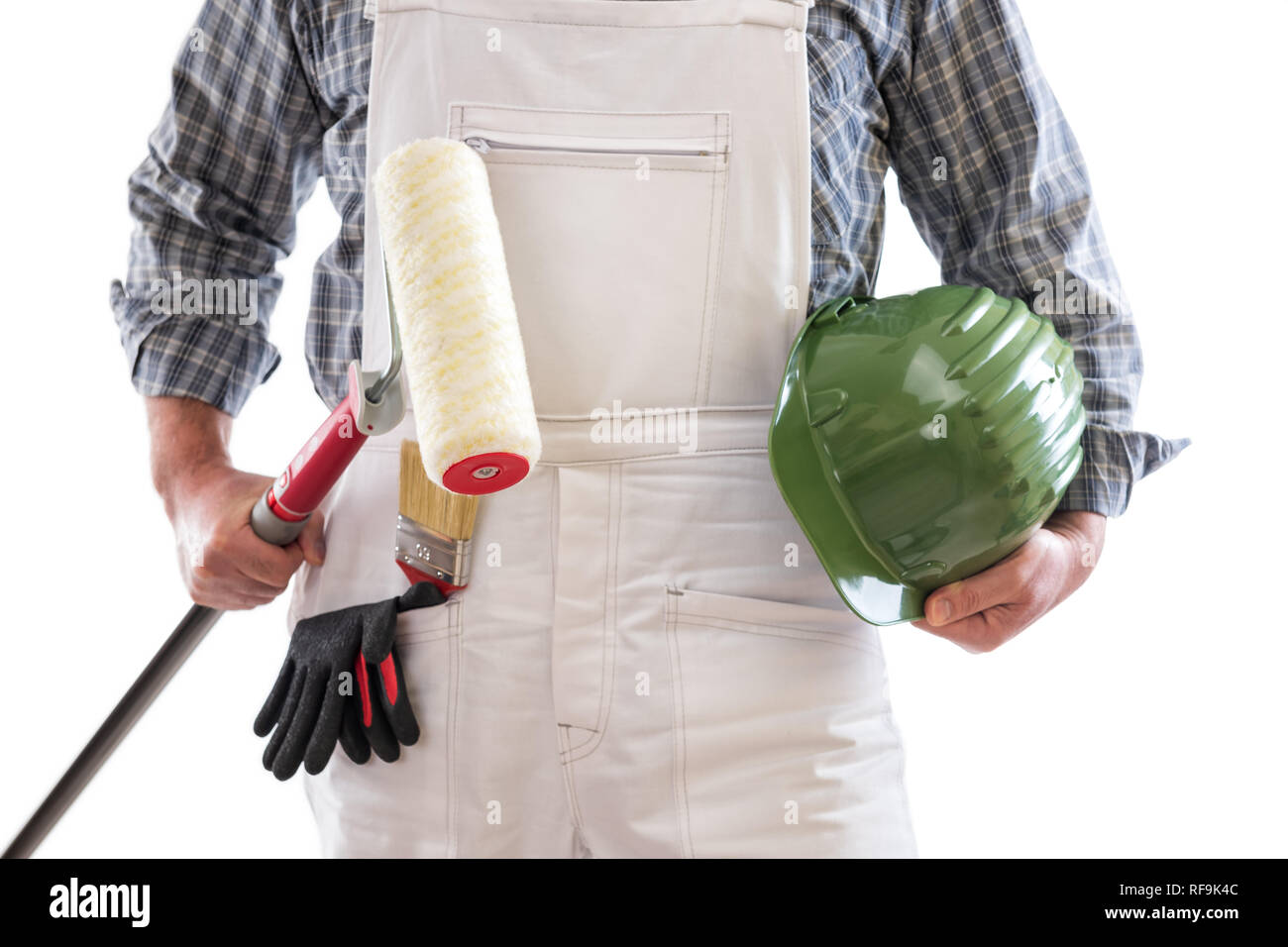 House painter worker with white work overalls, holds in his hand the ...