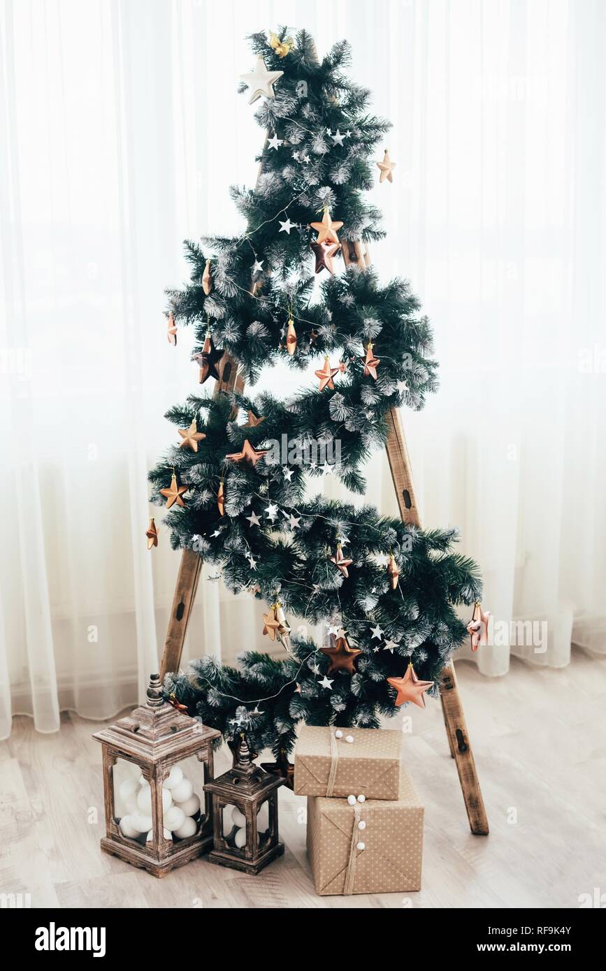 Christmas tree decorated with gold star isolated on white background ...