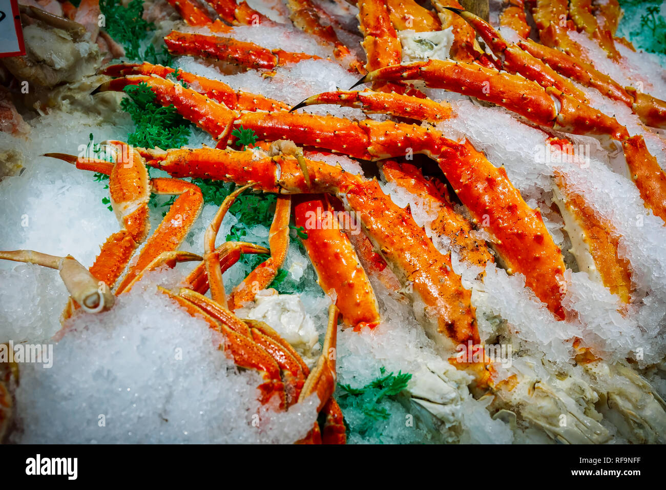 Crab legs sitting on ice at a market in Seattle, Washington Stock Photo ...