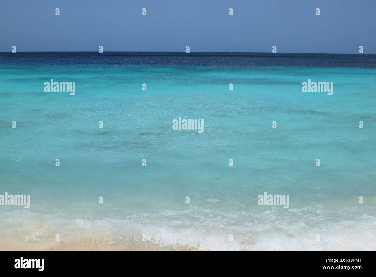 Calm blue sea by the beach Stock Photo - Alamy