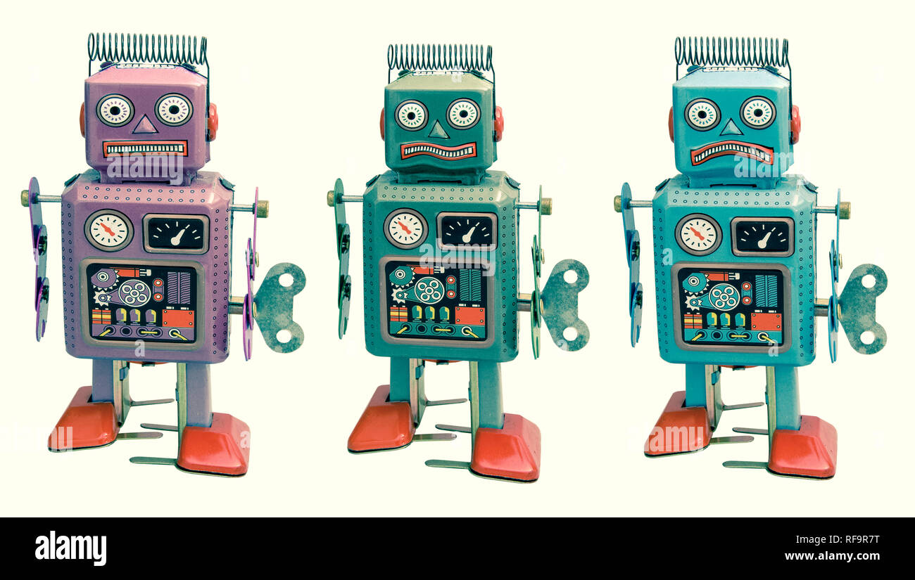 three grim perplexed and sad robots on white Stock Photo - Alamy