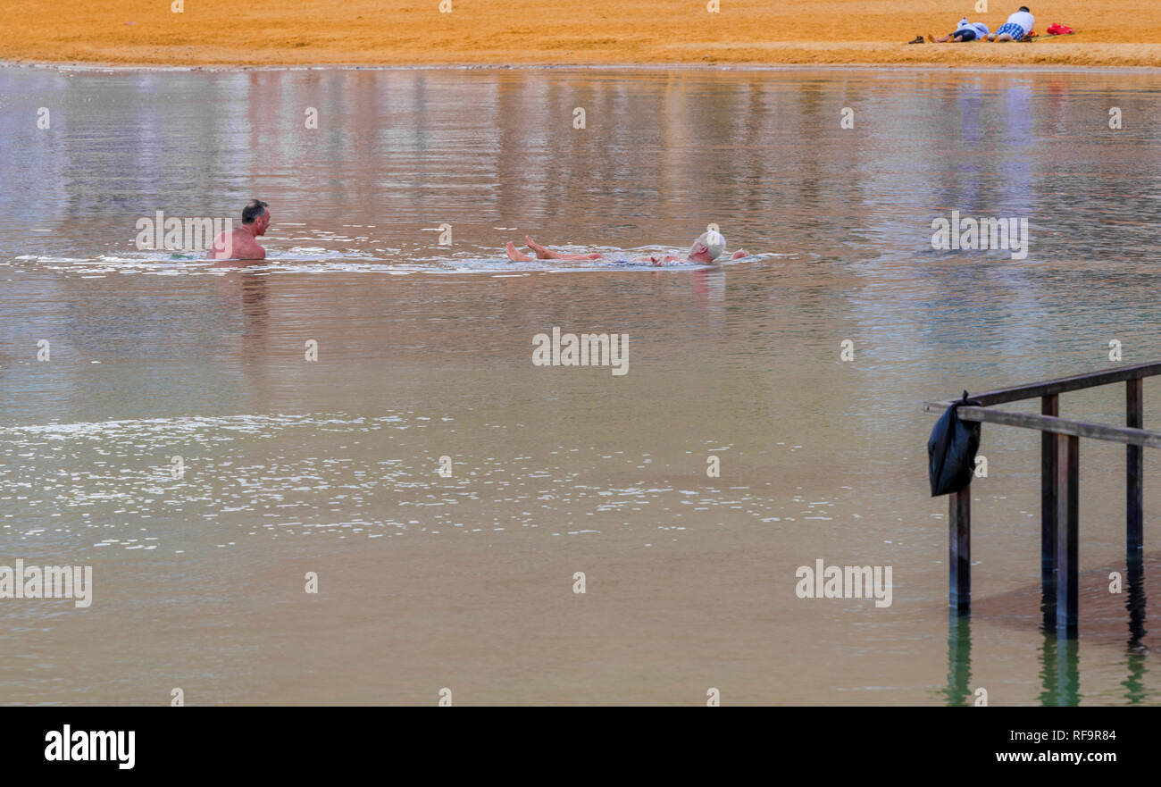 Tourists floating in the Dead Sea waters. Israel Stock Photo - Alamy