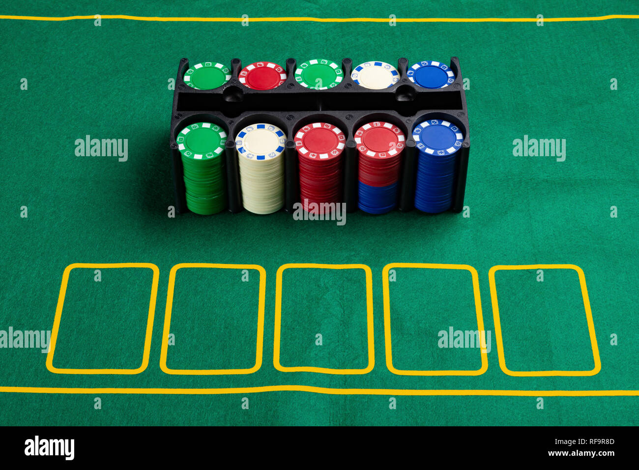 set of cashino chips on a green table Stock Photo - Alamy