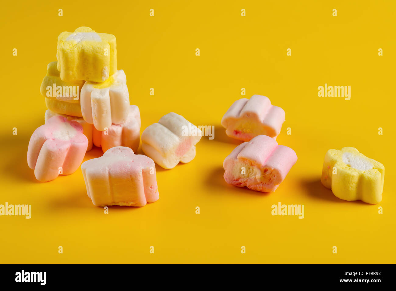 colorful marshmallow on a yellow background Stock Photo - Alamy