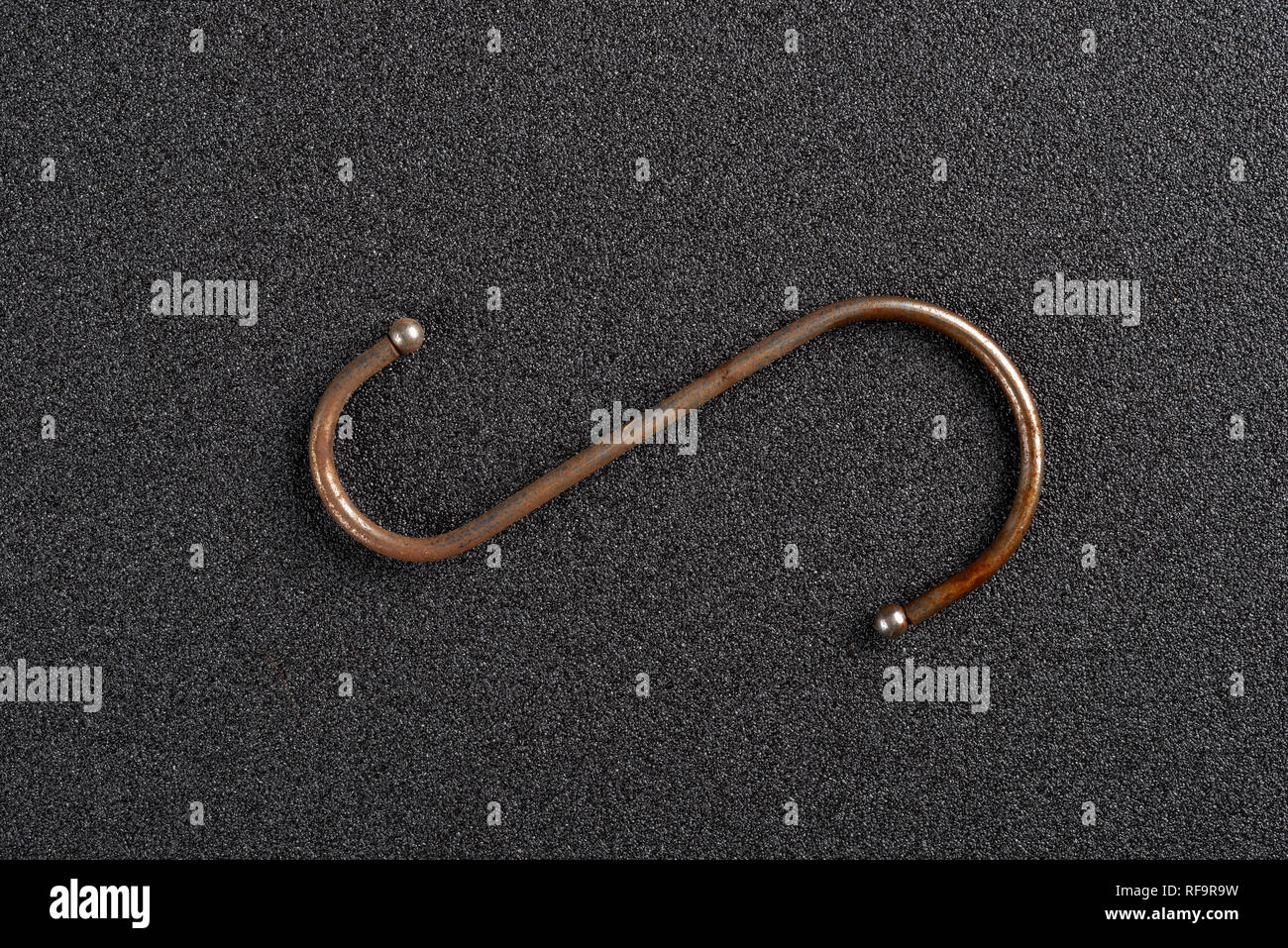 top view rusty steel hook on a dark background Stock Photo - Alamy