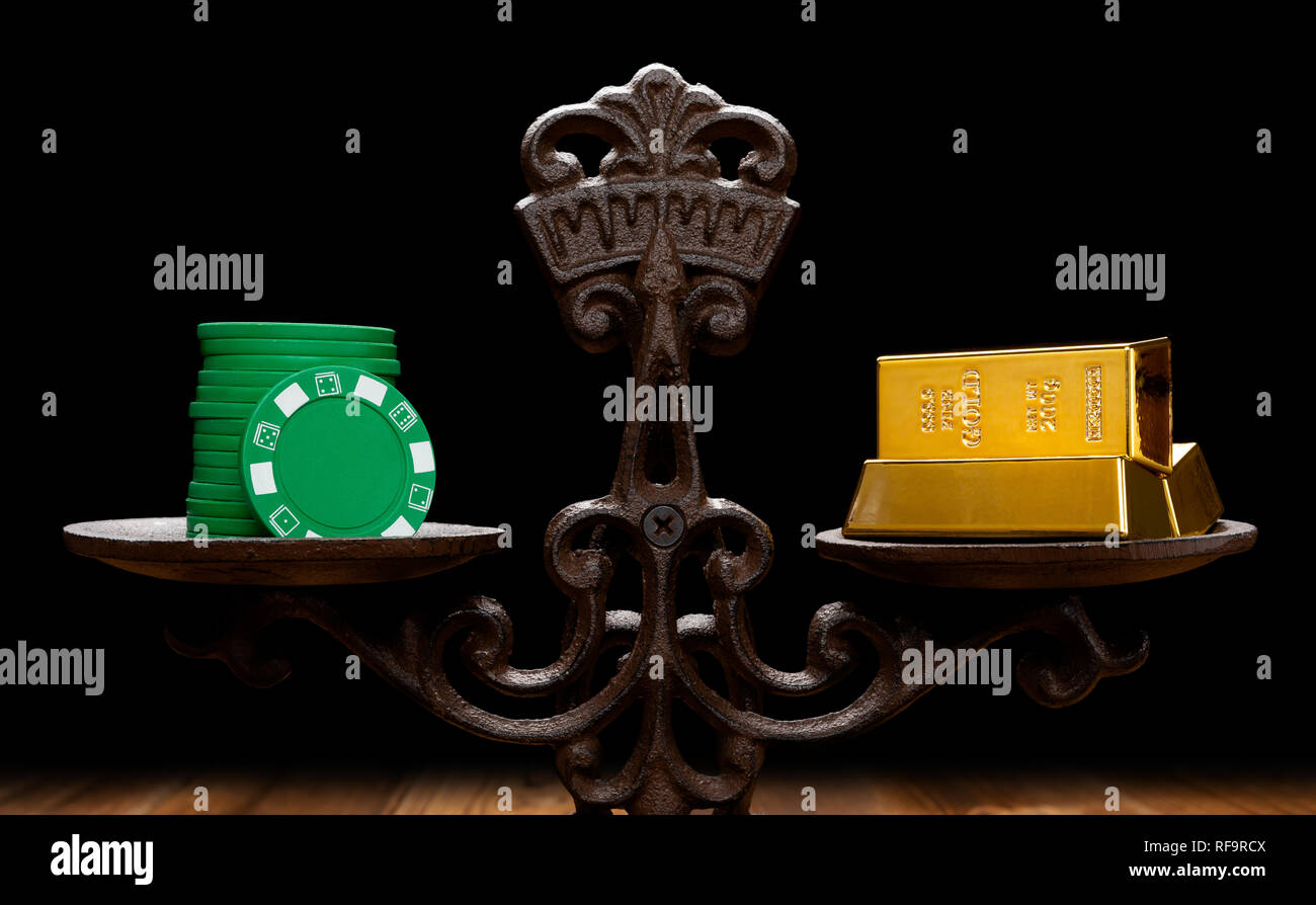cashino chips and gold bars on a balanced scale Stock Photo - Alamy