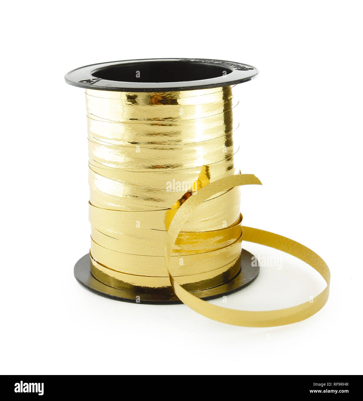 Golden ribbon in a roll Stock Photo - Alamy