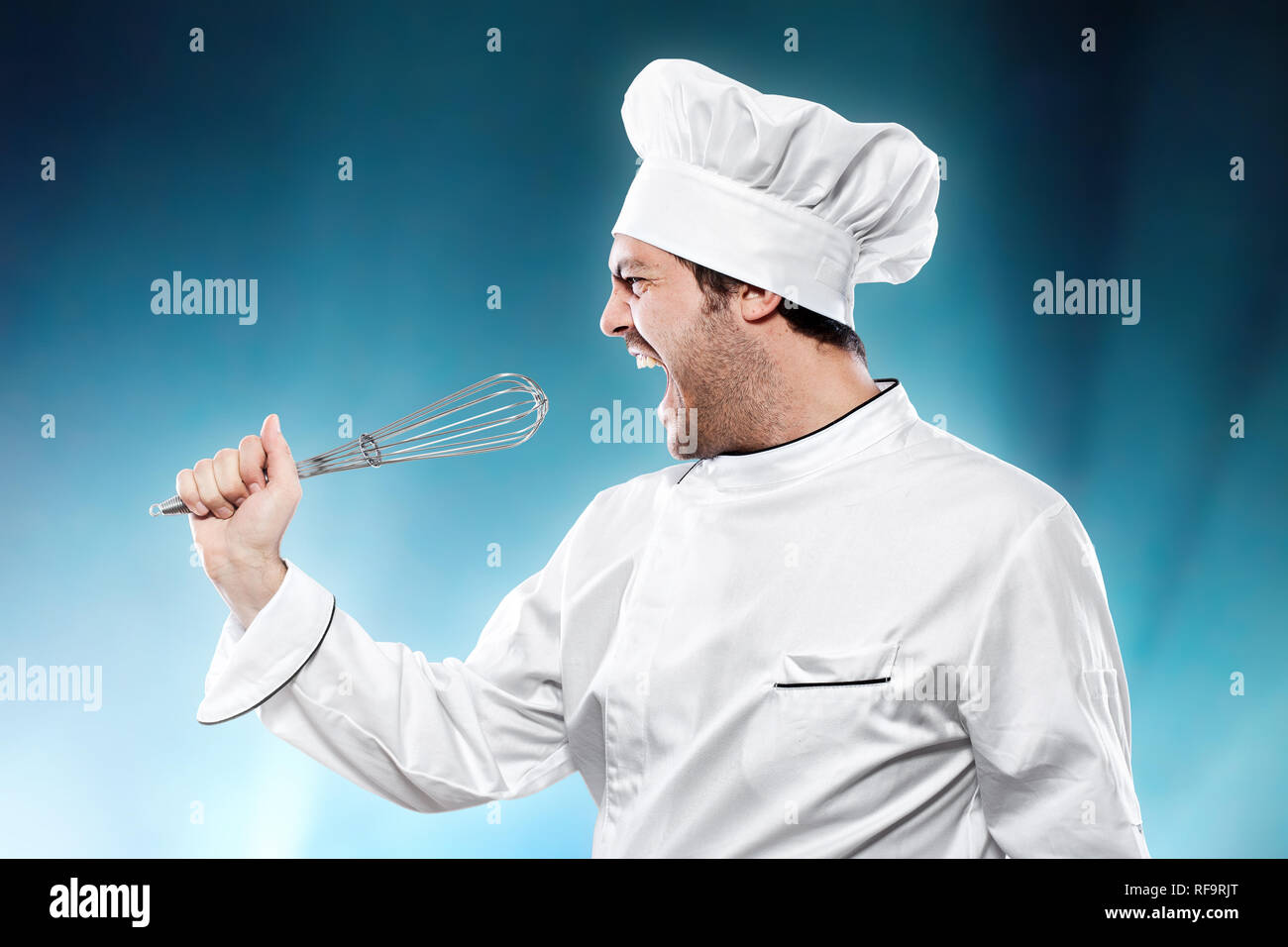Singing chef against blue background Stock Photo - Alamy