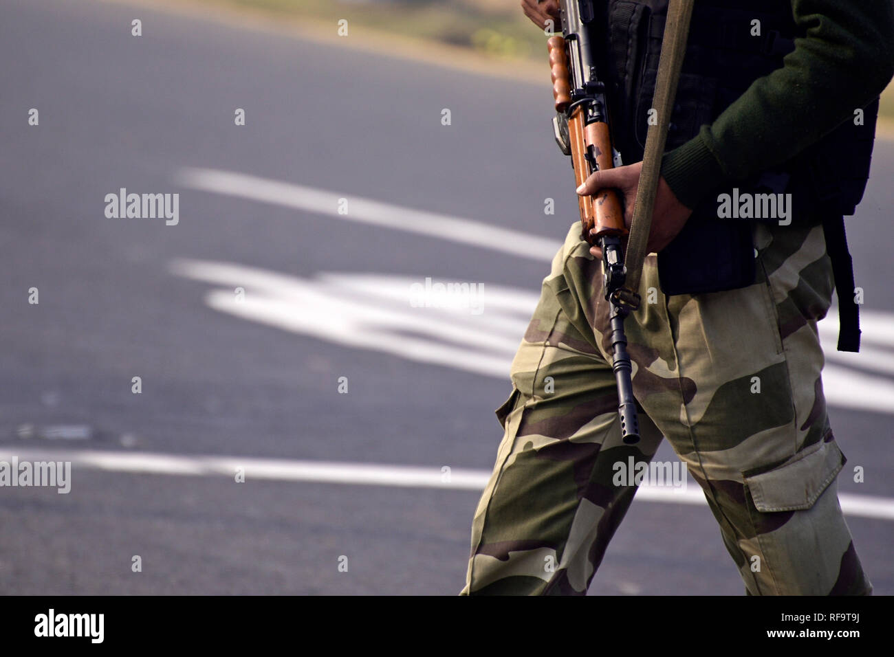 Security guard with rifle standing on outside to protect the area Stock ...